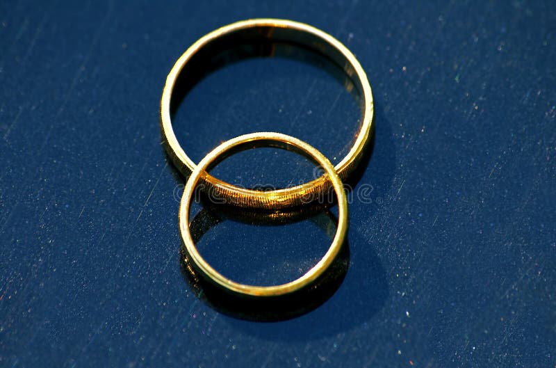 Pair of gold wedding rings stock image. Image of traditional - 2442005