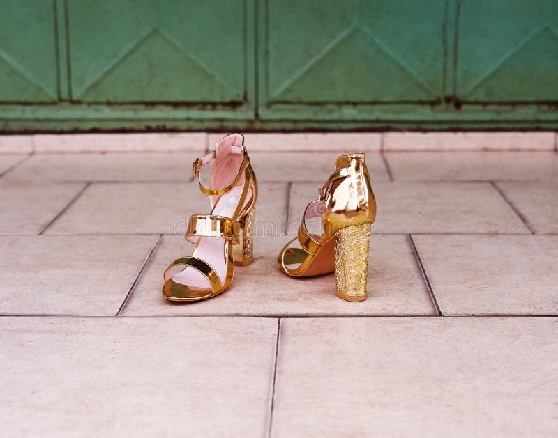 Pair of Golden Shoes on the Floor Stock Image - Image of shiny, pair ...