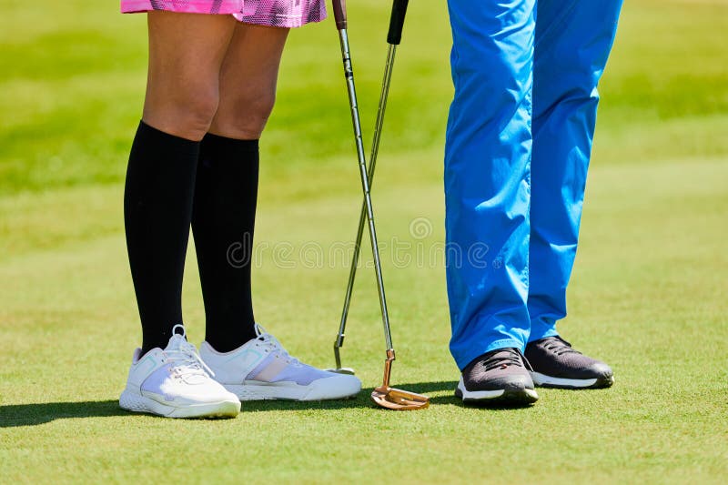 Pair of Golfers with Clubs Stand on Golf Course Stock Photo - Image of ...