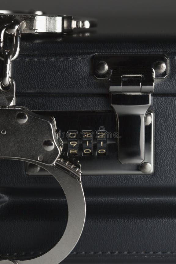Pair of Handcuffs on Briefcase with 911 on Lock Stock Photo - Image of ...