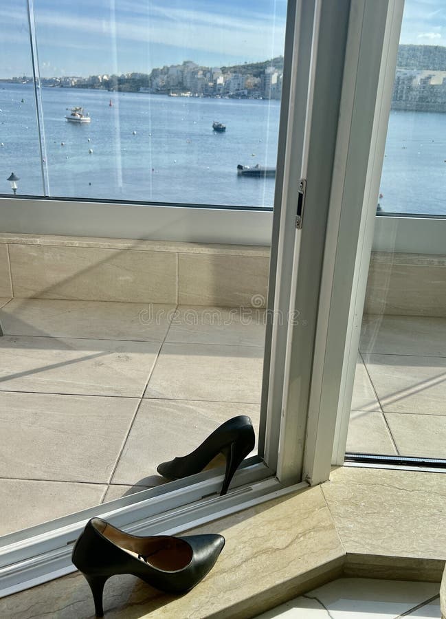 A Pair of High Heel Shoes on the Windowsill Stock Photo - Image of ...