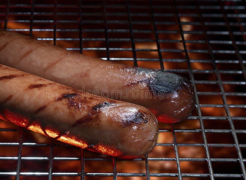 Pair of Hot Dogs Being Grilled Outdoors on a Grill Stock Photo - Image ...