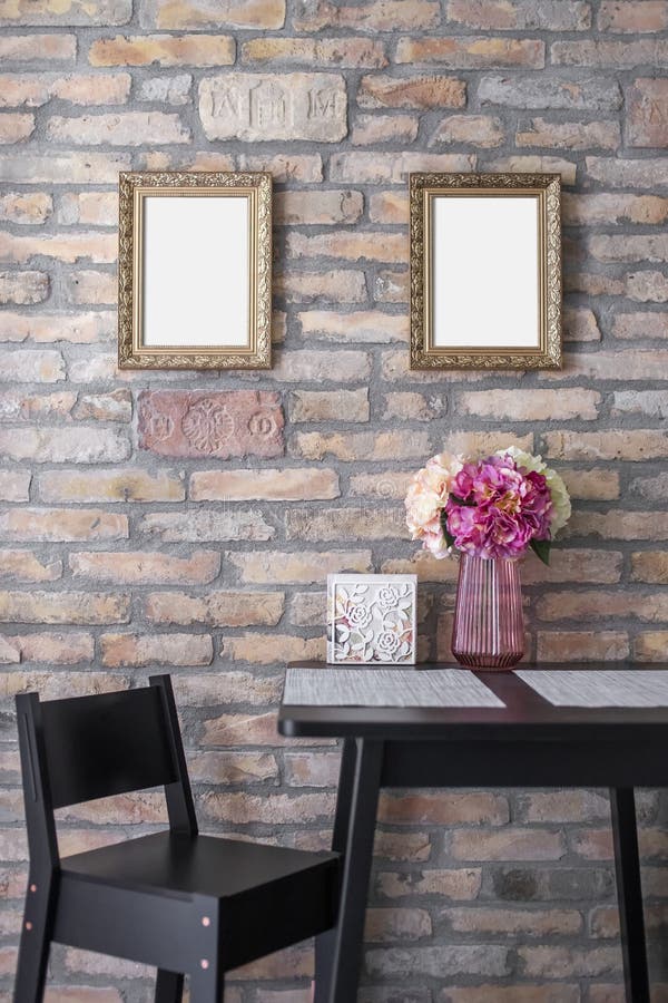 Pair of Identical Picture Frame Mockups Hanging on the Brick Wall Above ...