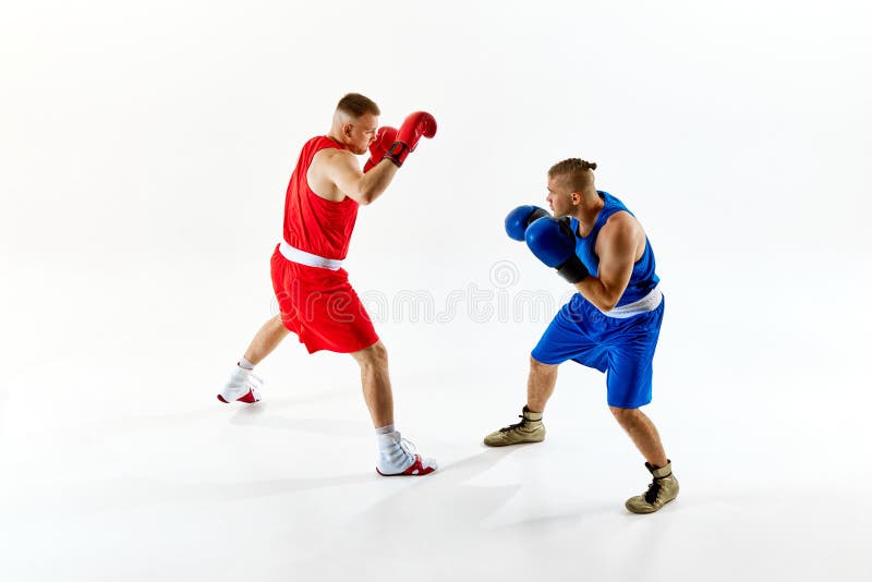 Pair of Kickboxers in Ring, Red Fighter Facing Off Against Blue Fighter ...