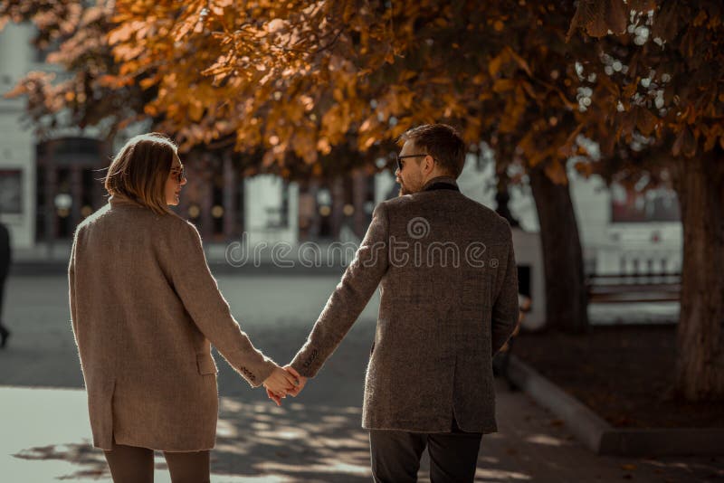 The Pair of Lovers Cuddle and Hold Hands during a Romantic Outing Stock ...