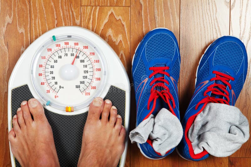 A Pair of Man S Feet Standing on a Scale Stock Photo - Image of floor ...
