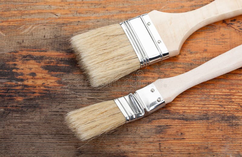 Pair of New Paint Brush on Old Wooden Board Construction Concept Stock ...