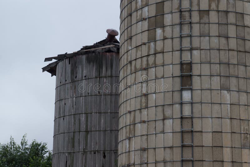 Pair of old grain silos stock photo. Image of farmland - 102317754
