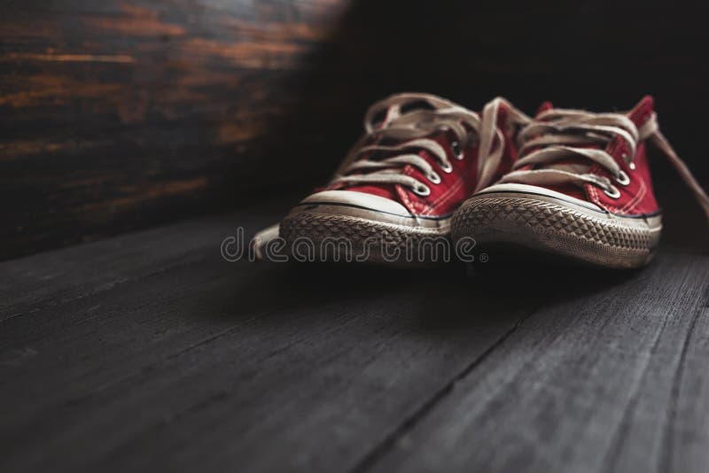 Pair of an Old, Worn Out Red Canvas Sneakers Left in the Corner Stock ...