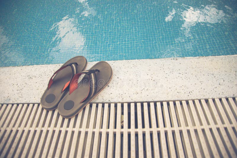 Pair of Slippers beside the Swimming Pool Stock Image - Image of ...