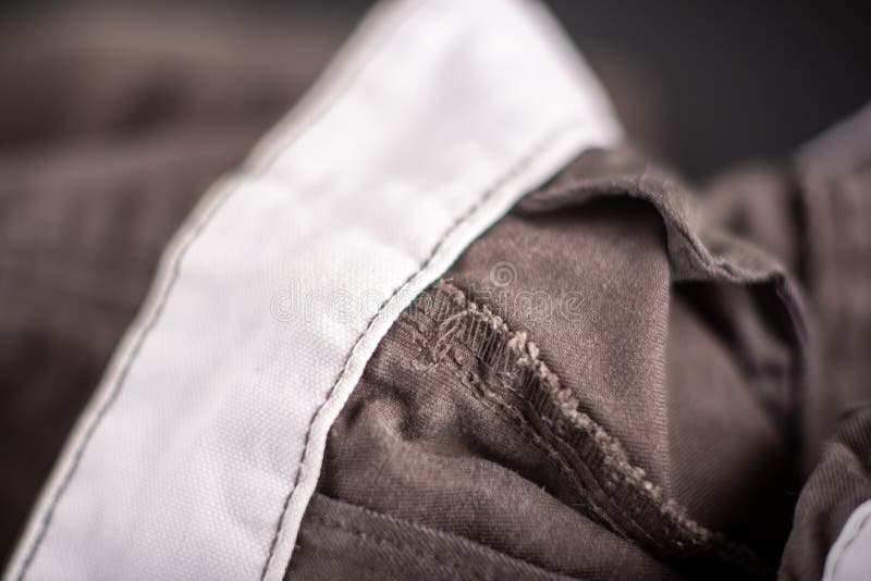 A Pair of Pants with a White Trim and a Brown Lining Stock Image ...