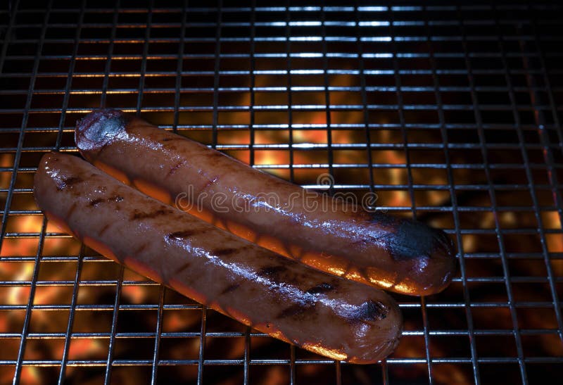Pair of Plump Hot Dogs Cooking Over a Fire Stock Image - Image of ...