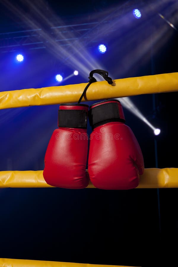Red Boxing Gloves Hangs Off the Boxing Ring Stock Photo - Image of ...