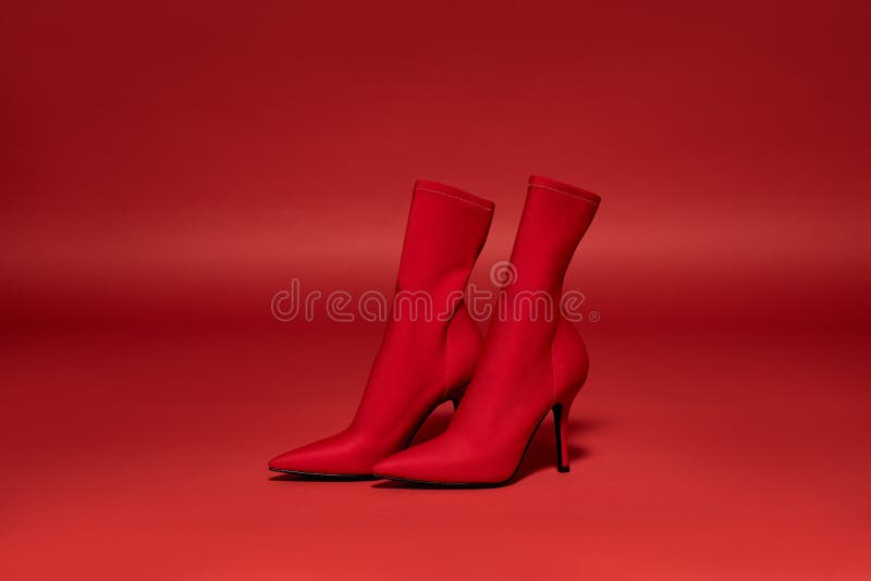 Pair of Red High-heel Shoes on the Deep Red Background Stock Photo ...