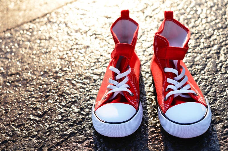 Pair of Red Trainers on Asphalt Stock Image - Image of copy, ground ...