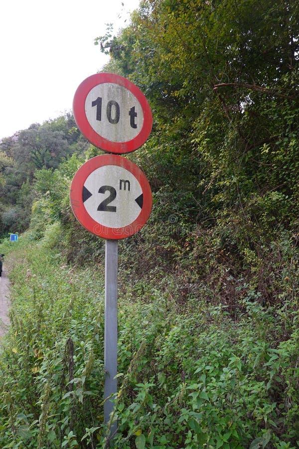 A Pair of Road Signs Showing a 10-ton Weight Limit and 2-meter Width ...