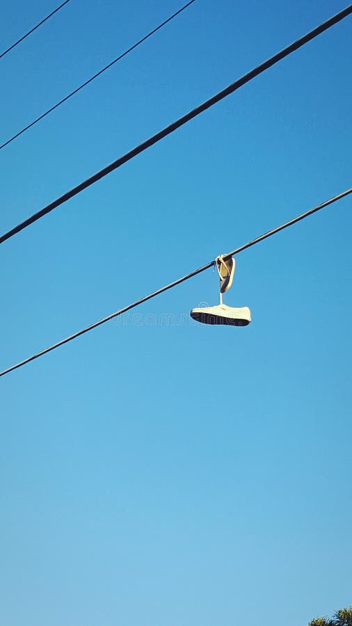Shoes on a wire stock image. Image of running, powerline - 106138047