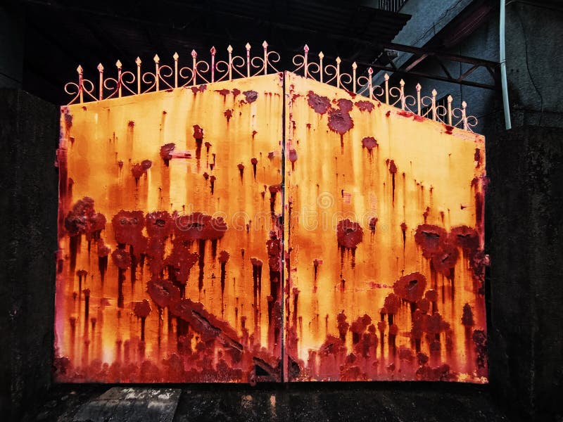 A Pair of Rusty Metal Doors Set within a Crumbling Stone Wall.door Rust ...