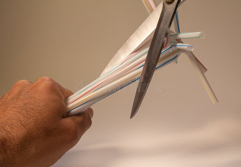 A Pair of Scissors Cutting a Bunch of Plastic Straws. Concept for ...