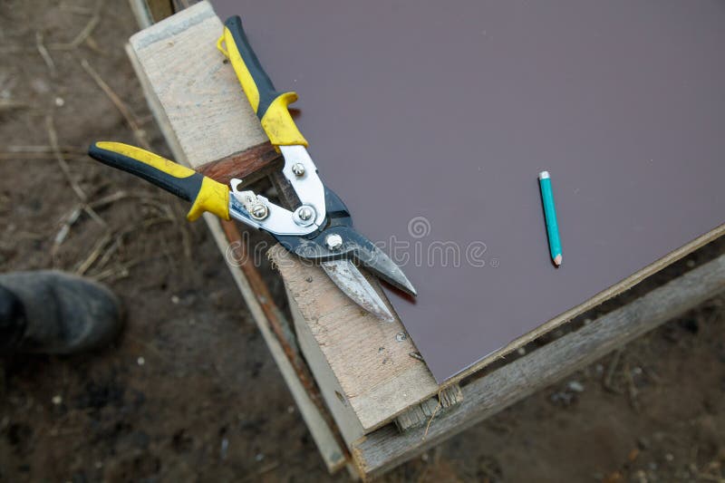 A Pair of Scissors and a Pencil are on a Table Stock Image - Image of ...
