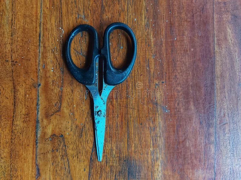 A Pair of Scissors on a Wooden Table Stock Image - Image of nurturing ...