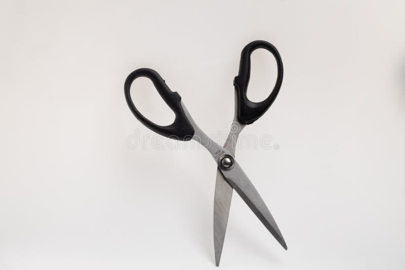 A Pair of Silver-bladed Scissors with Black Handles is Positioned Open ...