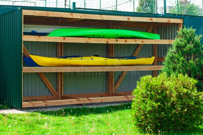A Pair of Single Kayaks in a Row 04 Stock Image - Image of garage, raft ...