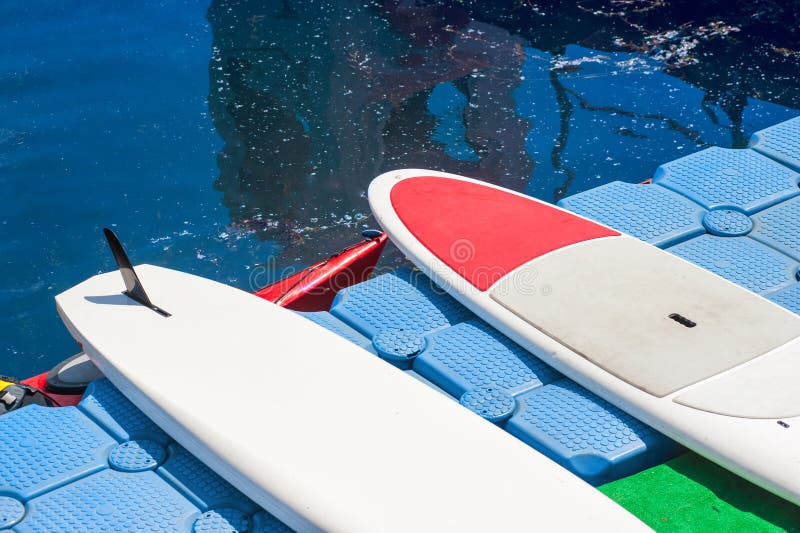 A Pair of Single Stand Up Paddle in a Row 01 Stock Photo - Image of ...
