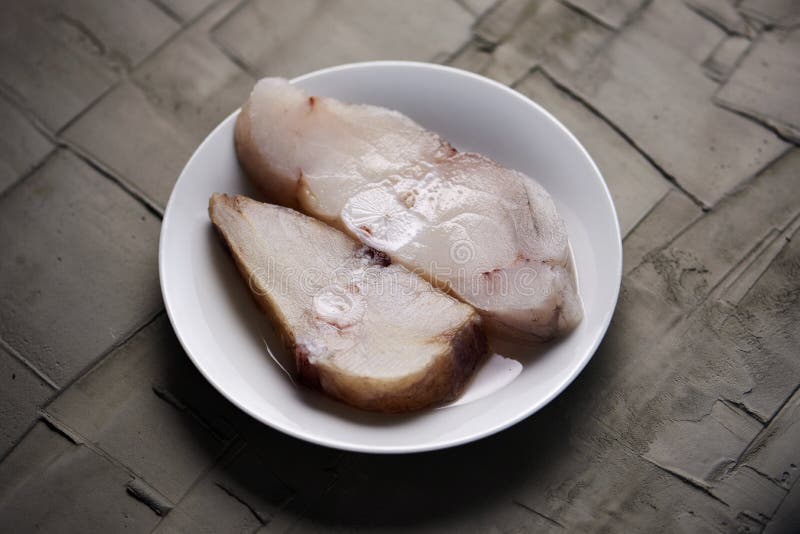 Slices of raw monkfish stock image. Image of pieces - 112119851
