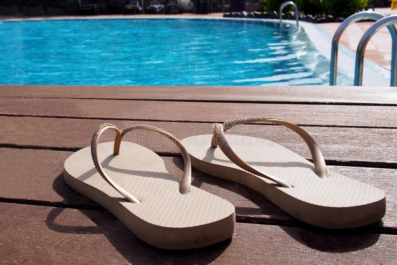 Pair of Slippers by a Swimming Pool Stock Photo - Image of nature ...