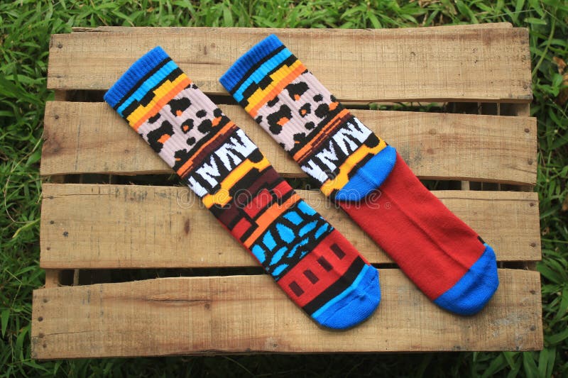 Pair of Socks with Various Patterns Lying on a Wooden Base Stock Image ...