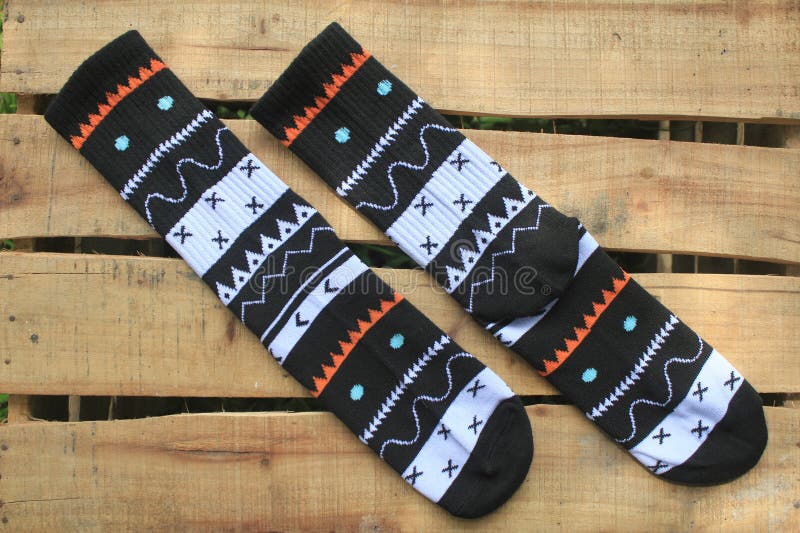 Pair of Socks with Various Patterns Lying on a Wooden Base Stock Image ...