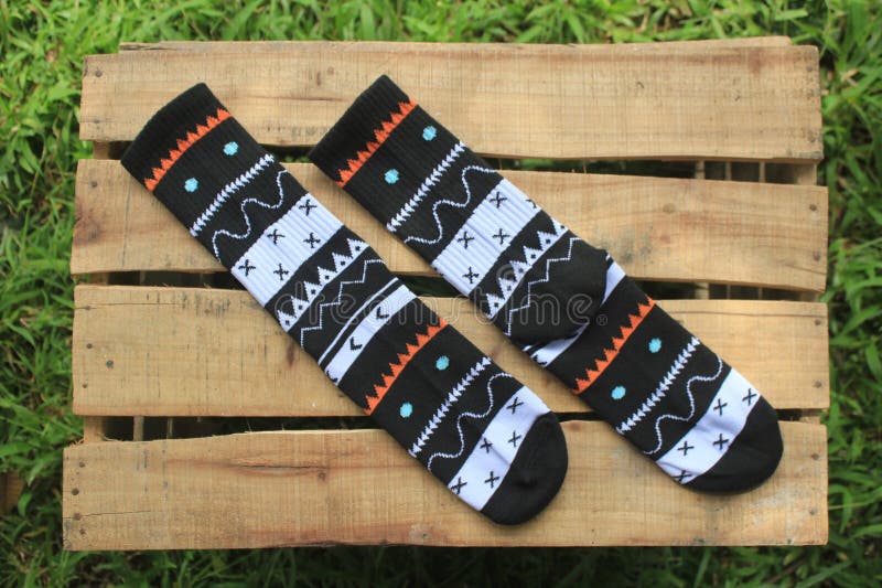 Pair of Socks with Various Patterns Lying on a Wooden Base Stock Image ...