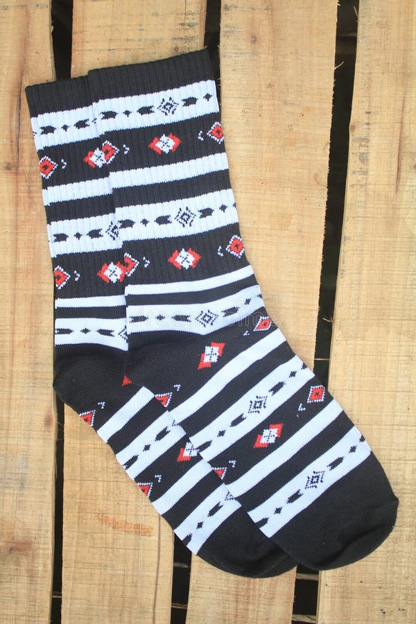 Pair of Socks with Various Patterns Lying on a Wooden Base Stock Photo ...
