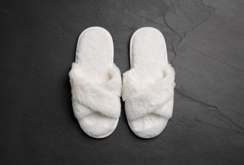 Pair of Soft Slippers on Dark Grey Floor, Top View Stock Photo - Image ...