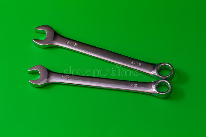Pair of Steel Wrenches on Solid Green Stock Image - Image of fractional ...