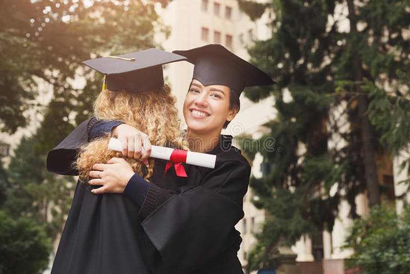 Graduates Having Group Hug on Graduation Day Stock Image - Image of ...
