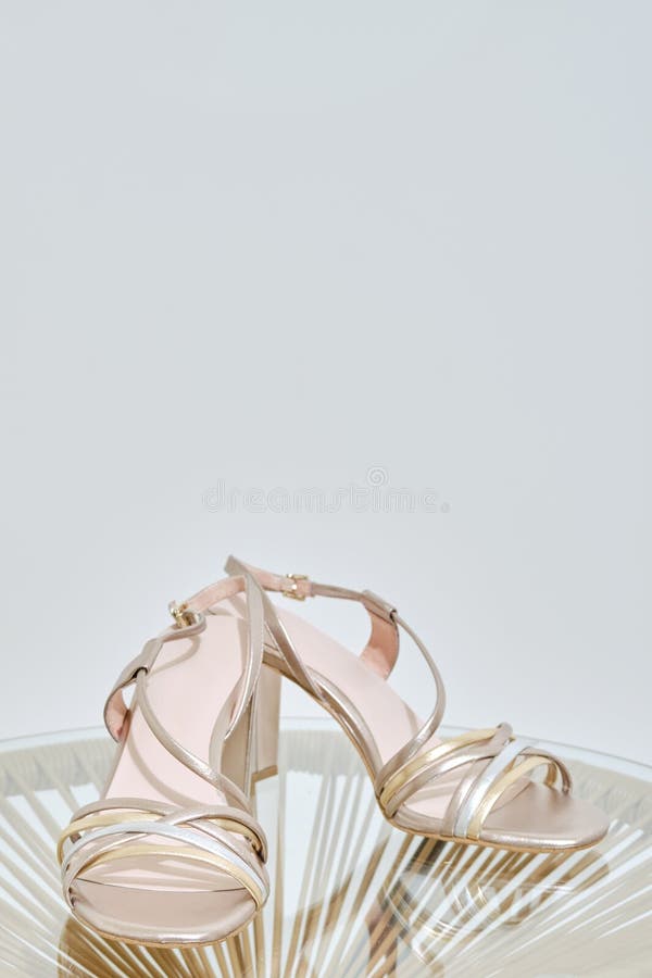 A Pair of Stylish High Heel Shoes Elegantly Placed on a Modern Wicker ...