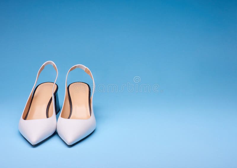 A Pair of Stylish Pointed-toe Heel Shoes with Open Back on a Gradient ...