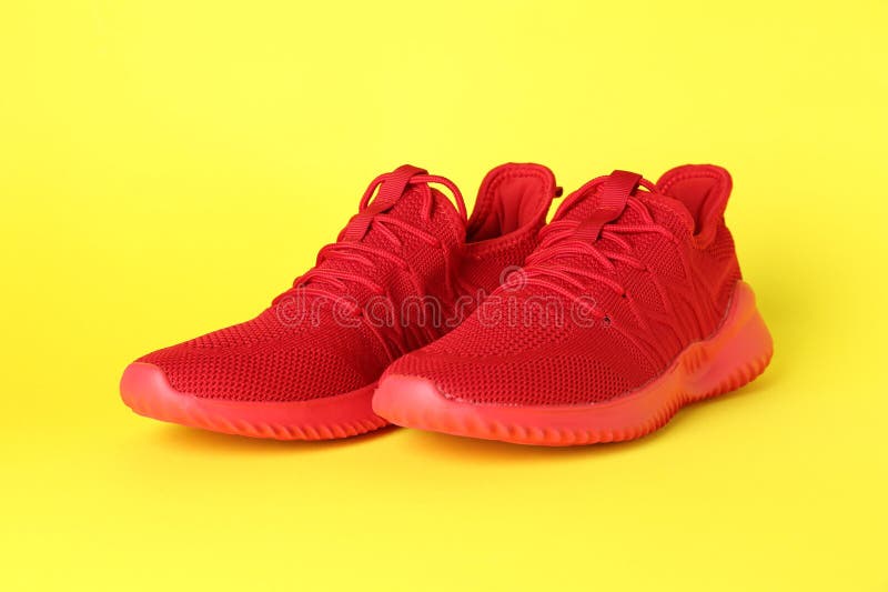 Pair of Stylish Red Sneakers on Yellow Background Stock Photo - Image ...