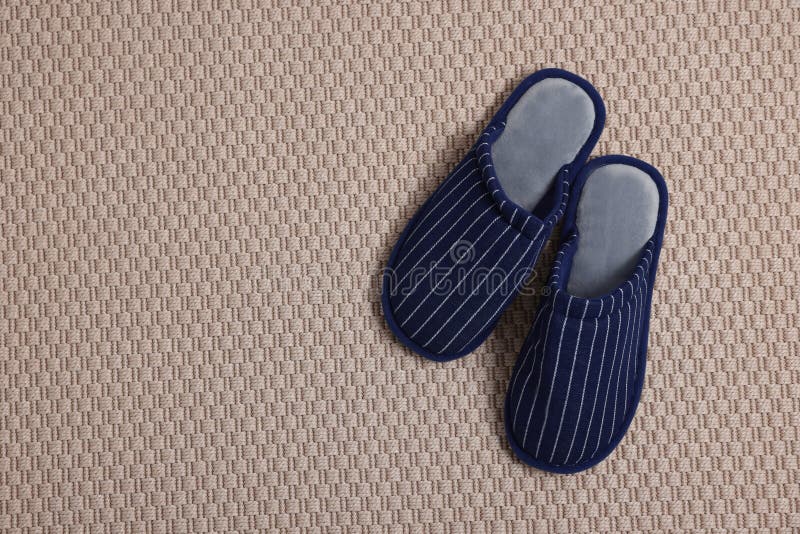 Pair of Stylish Slippers on Carpet, Top View. Space for Text Stock ...