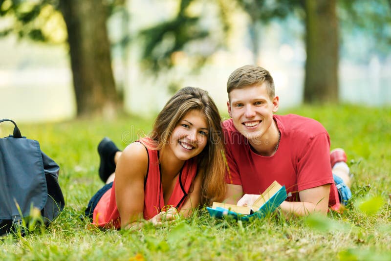 Pair Successful Students with a Textbook in a Park Stock Photo - Image ...