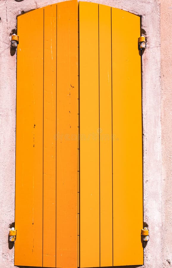 Pair of Tall, Yellow, Wood, Closed, Shutters Stock Photo - Image of ...