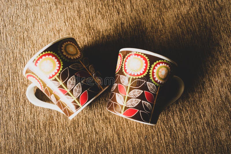 A Pair of Tea Cups Kept on a Soft Brown Surface Creating a Vintage ...