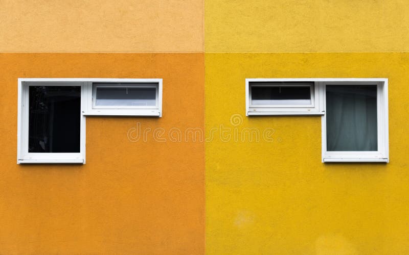 A Pair of Two Windows on a Yellow and Orange Facade Stock Photo - Image ...