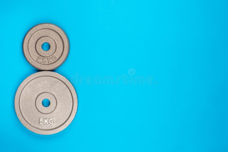A Pair of Weights on Blue Background Stock Photo - Image of movement ...