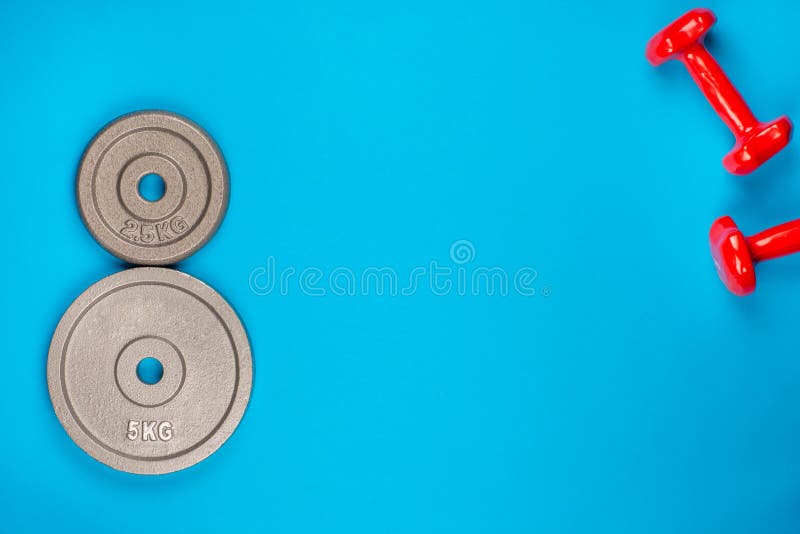 A Pair of Weights on Blue Background, Shot from Above Stock Image ...