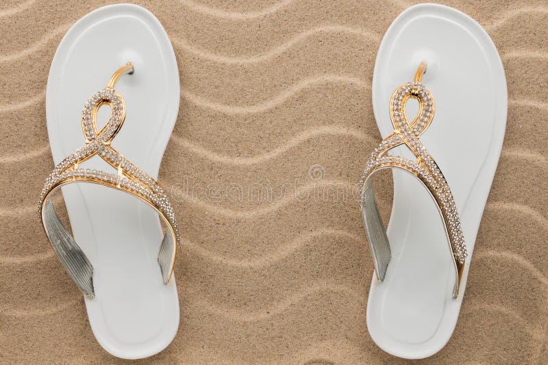 Pair of White Beach Sandals in Rhinestones Stand on the Sand. Stock ...