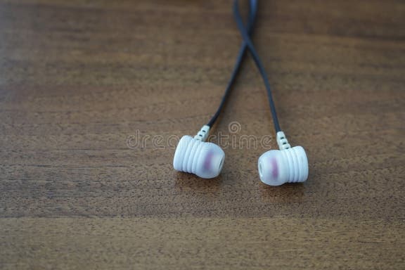 A Pair of Earphones on the Table Stock Photo - Image of earphones, pair ...