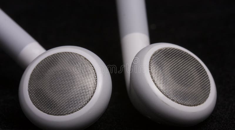 Earphones on a Black Surface Stock Photo - Image of mesh, plastic ...